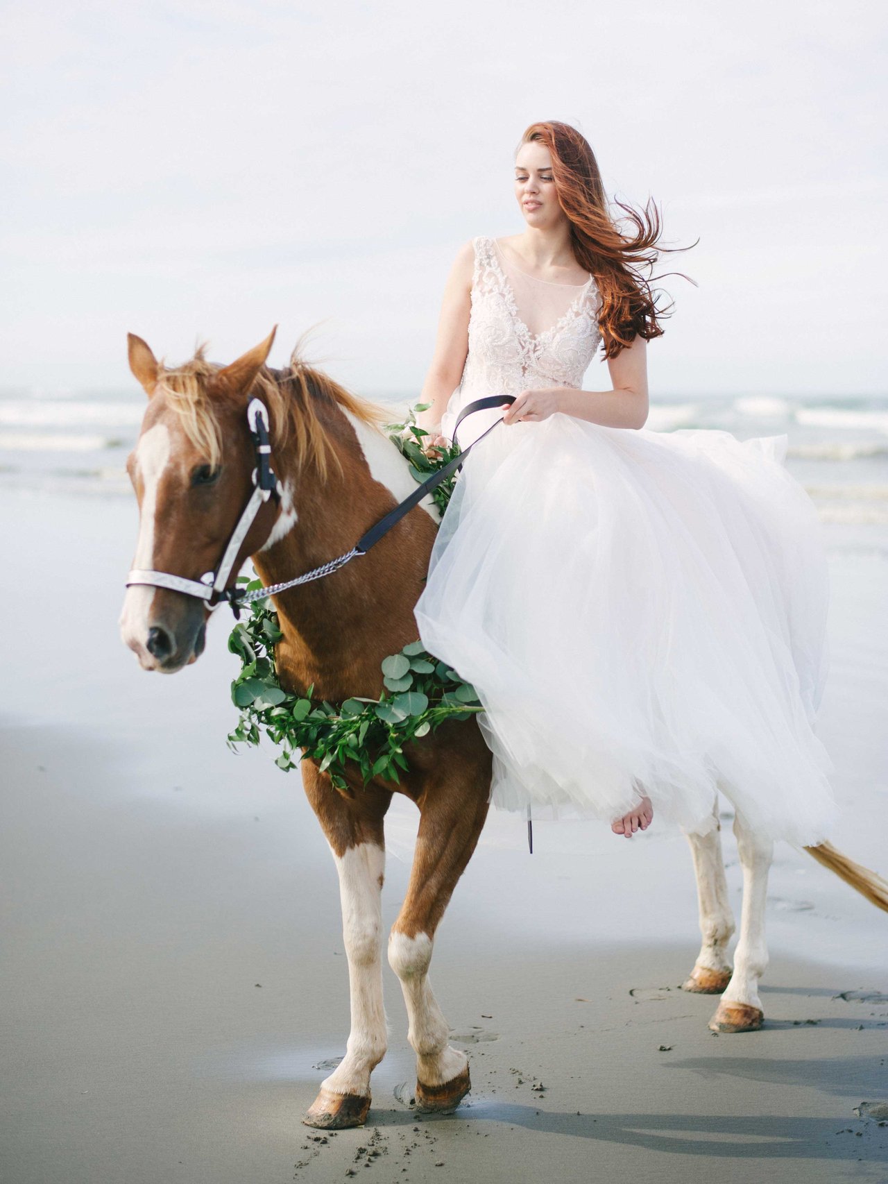 Bride Riding a Horse on a Beach