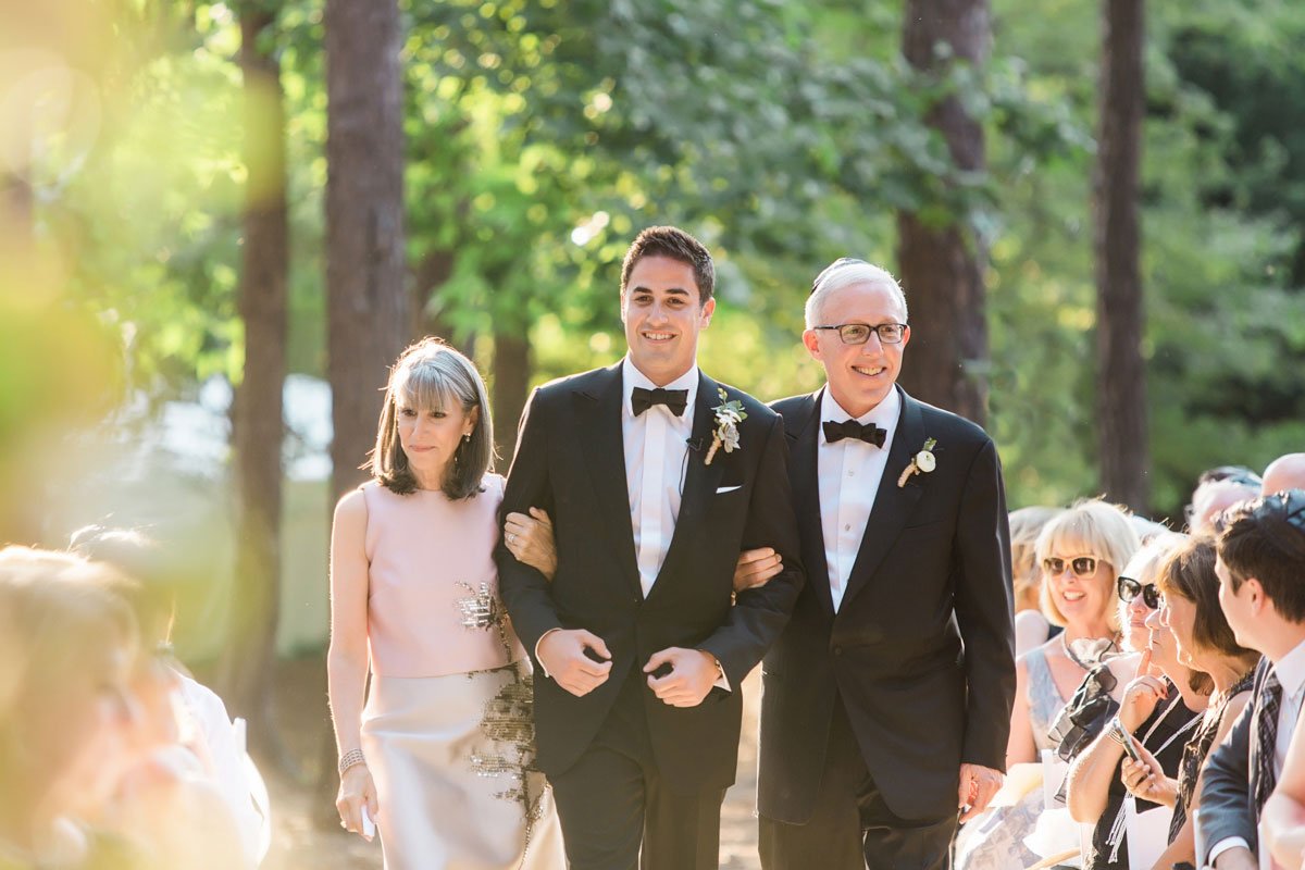 Groom Walking Down Aisle with Mom & Dad