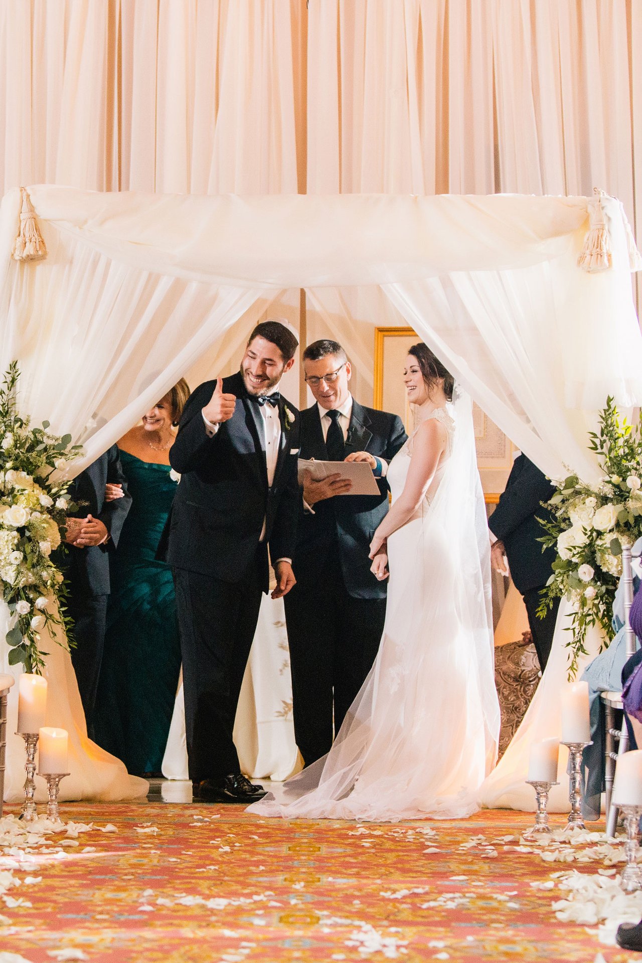 Groom Gives a Thumbs Up at Ceremony