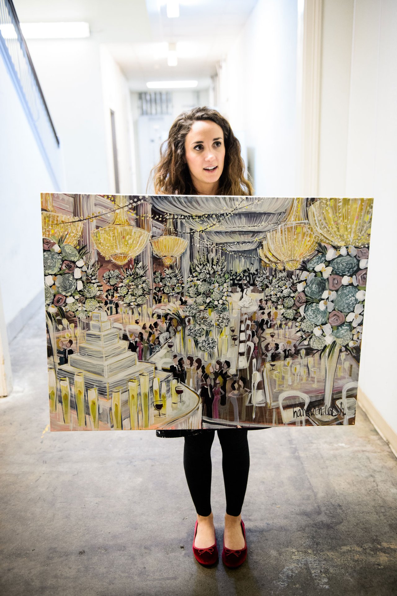 Live Event Artist Holding Painting