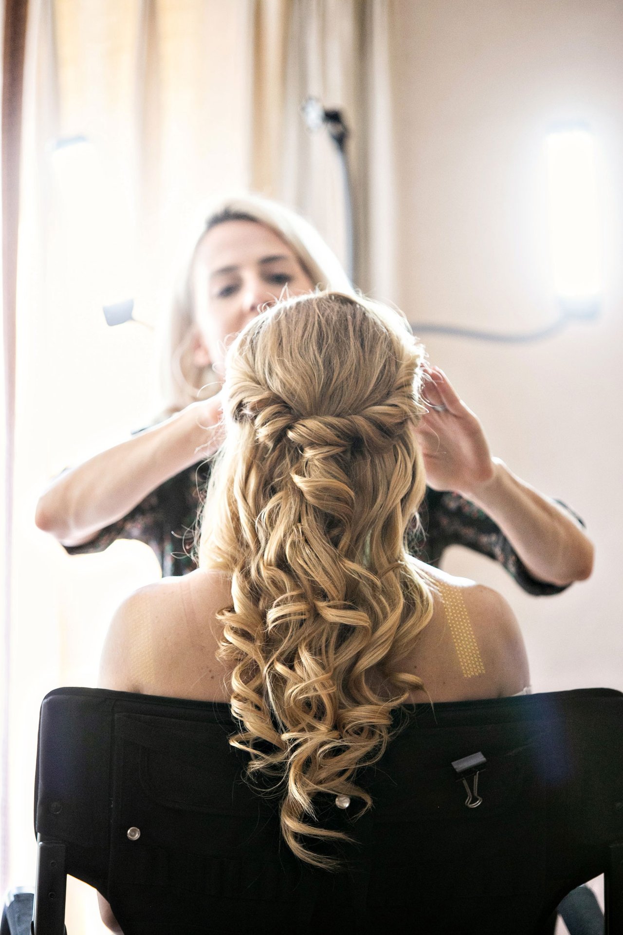 Bride with Curls Getting Makeup Done
