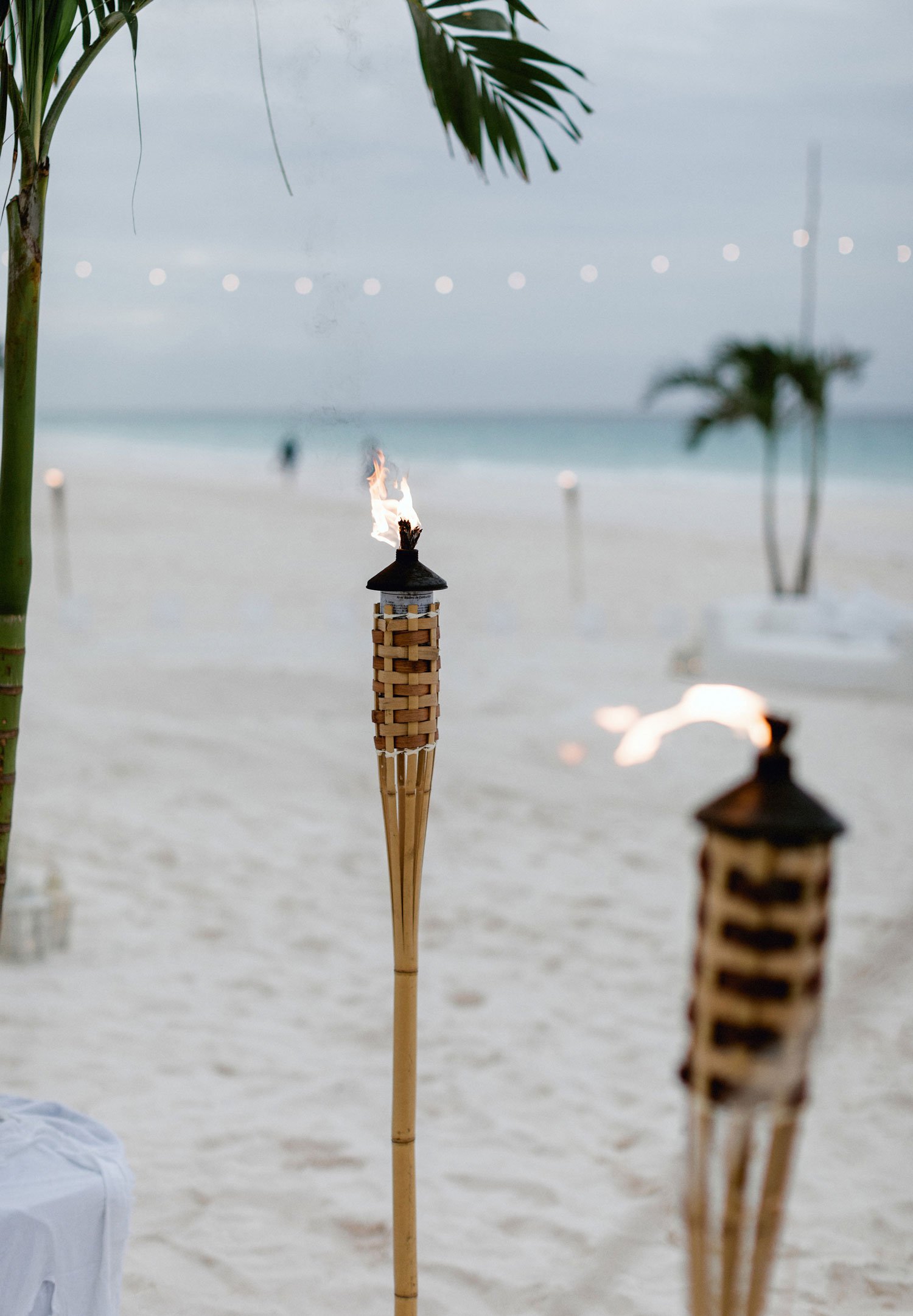 Tiki Torches on Beach in Bahamas