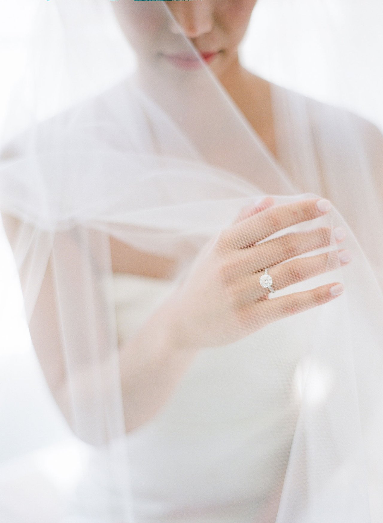 Pretty Veil Over Bride's Engagement Ring