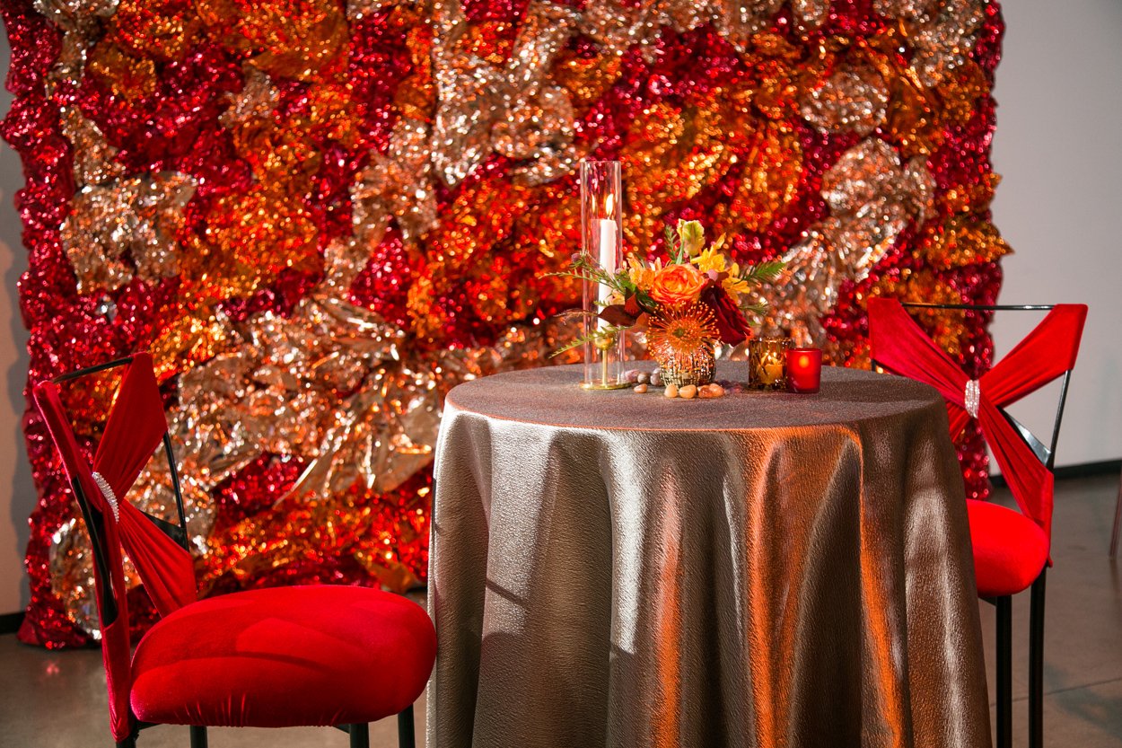 Sweetheart Table in Front of Foil Backdrop