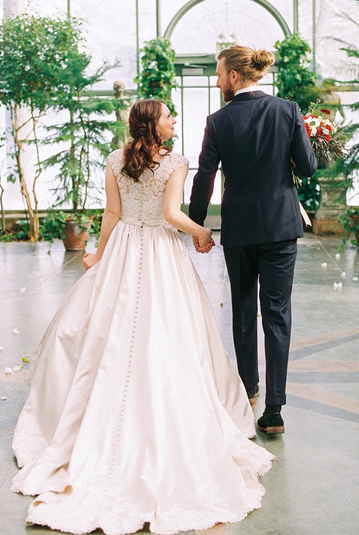 Groom, Bride Showing off Back of Gown