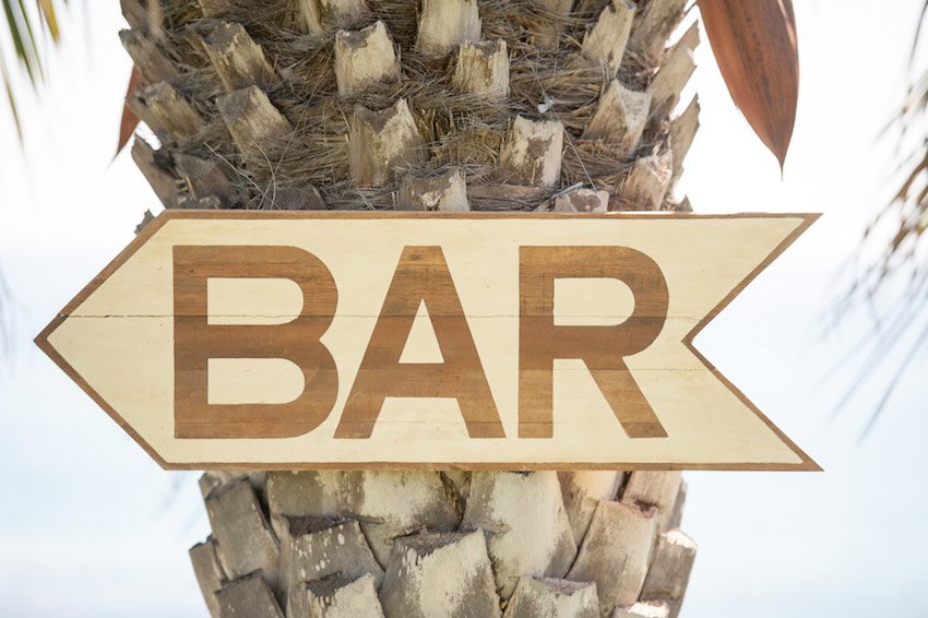 Bar Arrow Sign on Palm Tree