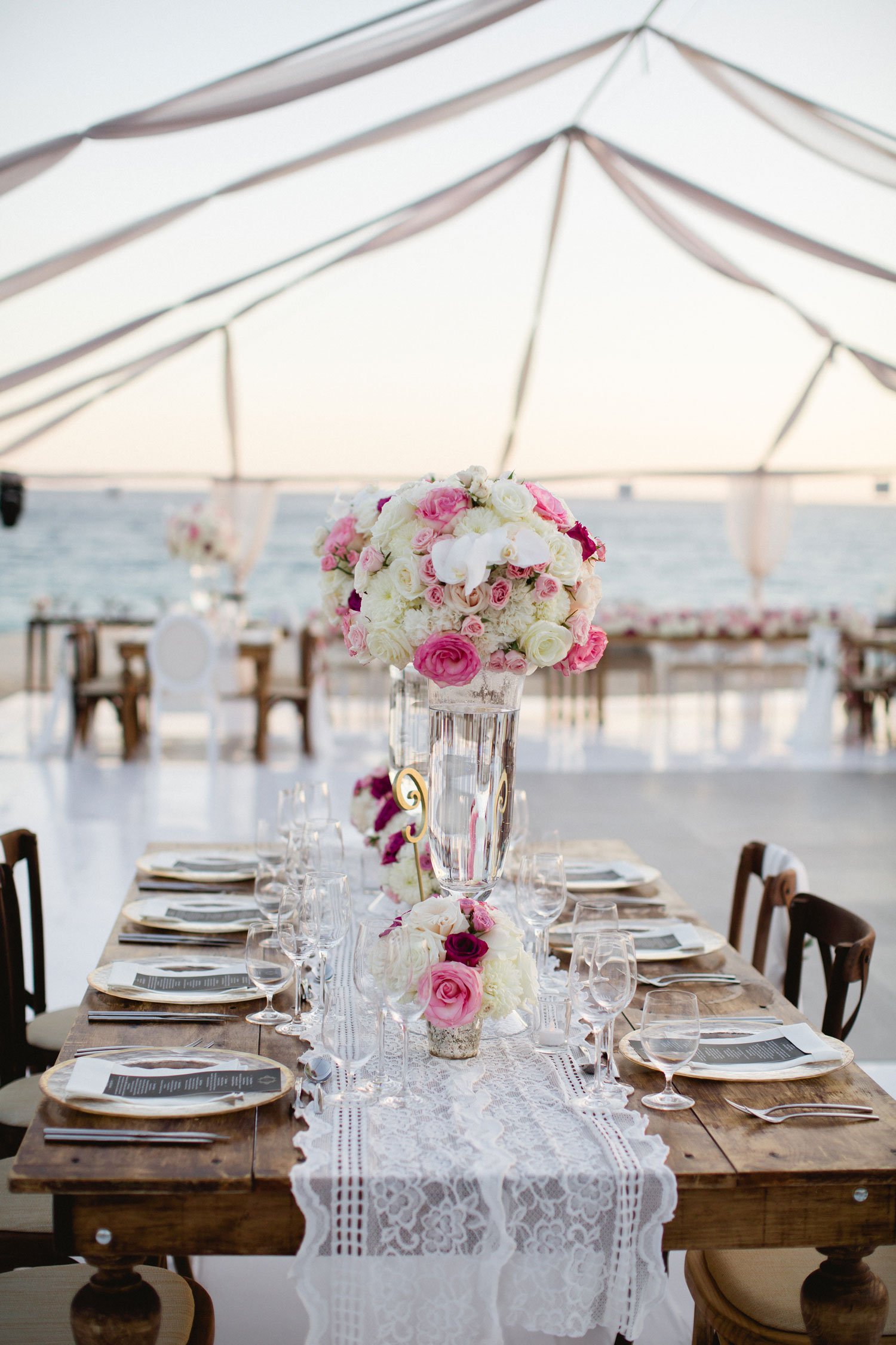 Tented Beach Wedding with Wood Tables