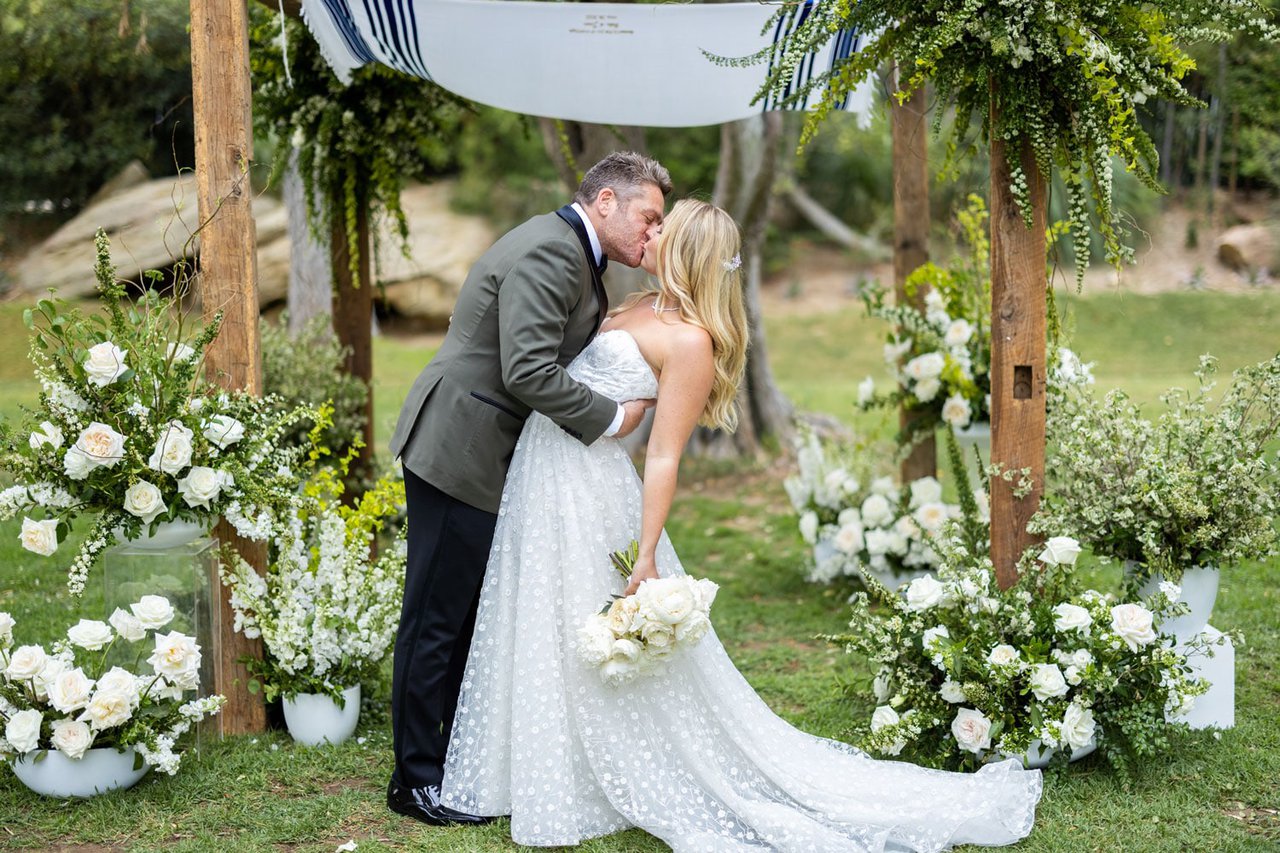 Bride & Groom Kiss Under Neutral Chuppah