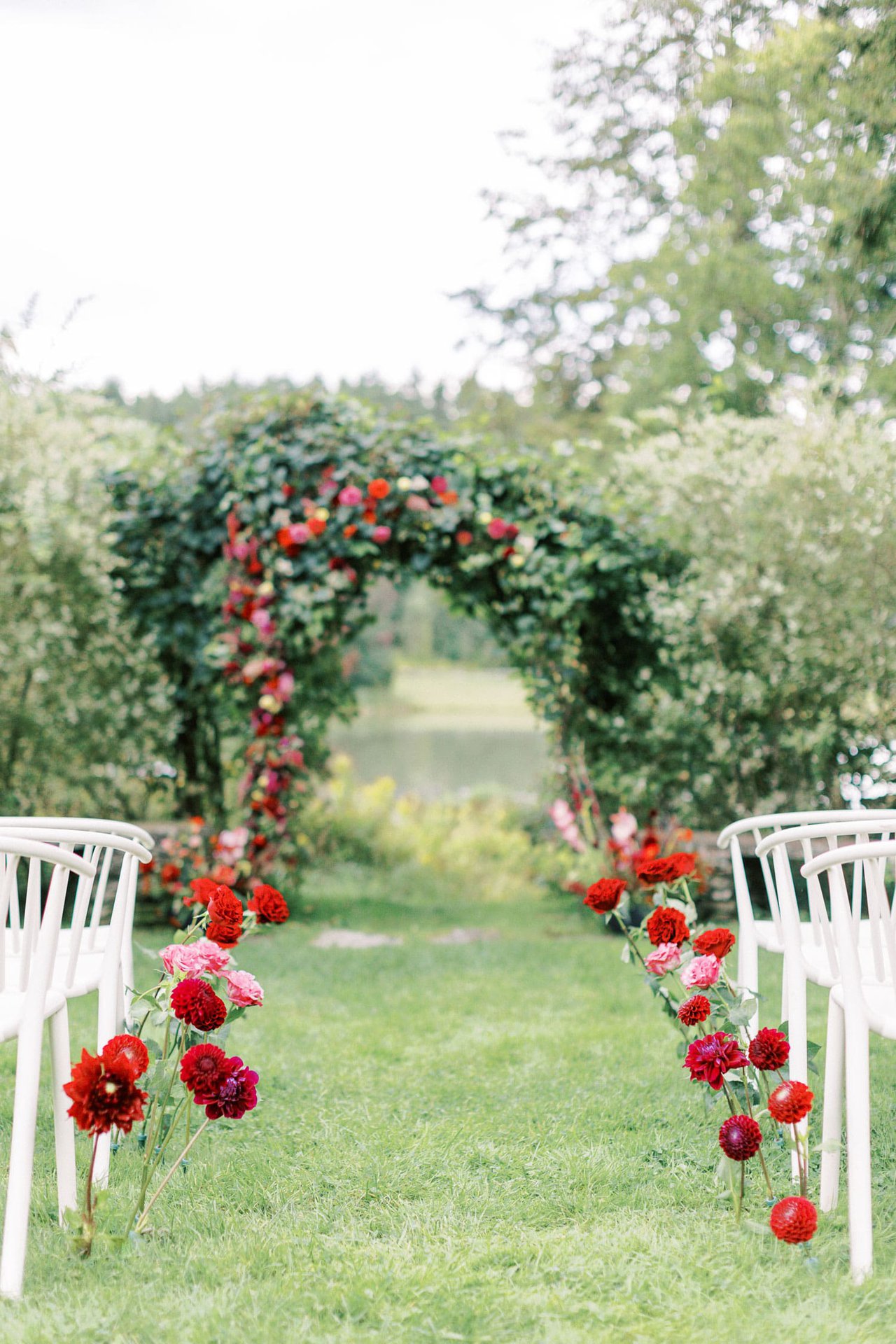 Pink & Red Flower Stems Along Wedding Aisle