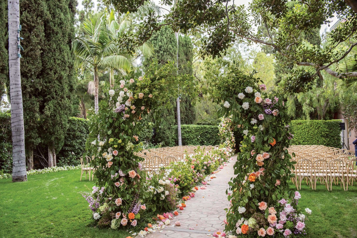 Greenery & Pastel Floral Arch to Ceremony