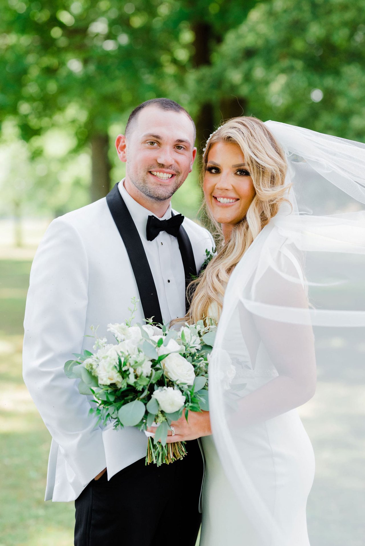 Bride & Groom in White Wedding Attire