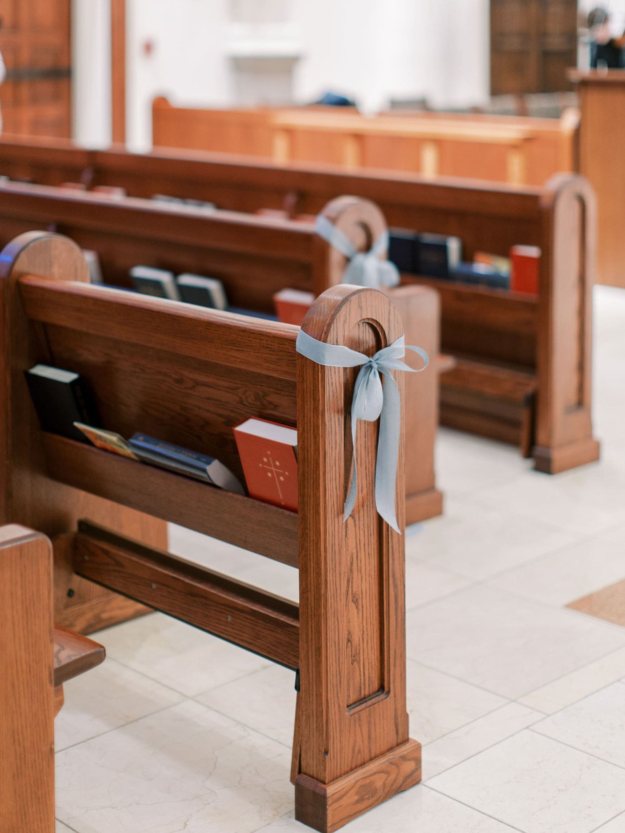 Church Pews with Light Blue Ribbons