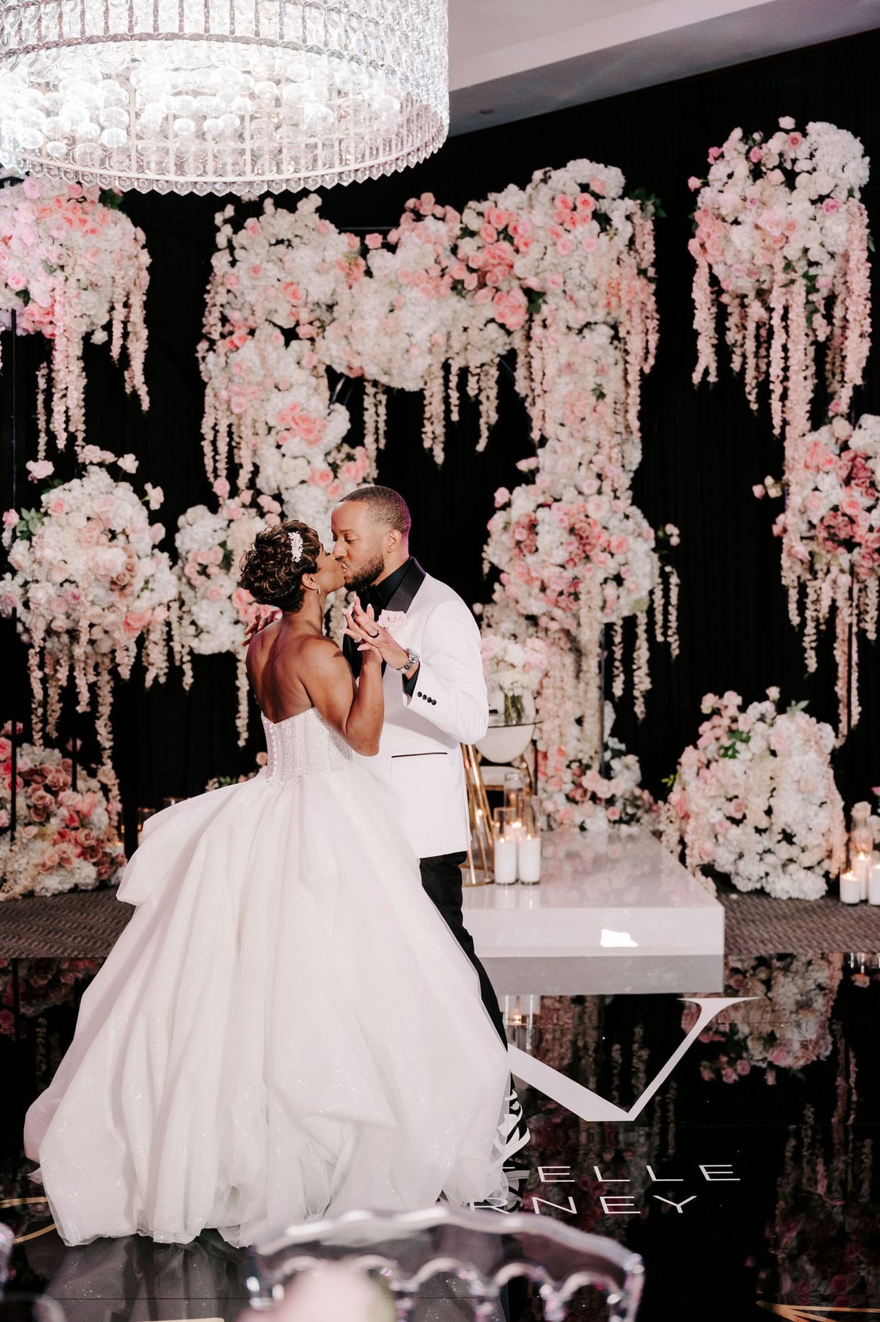 Bride & Groom Kiss at Glam Wedding Reception