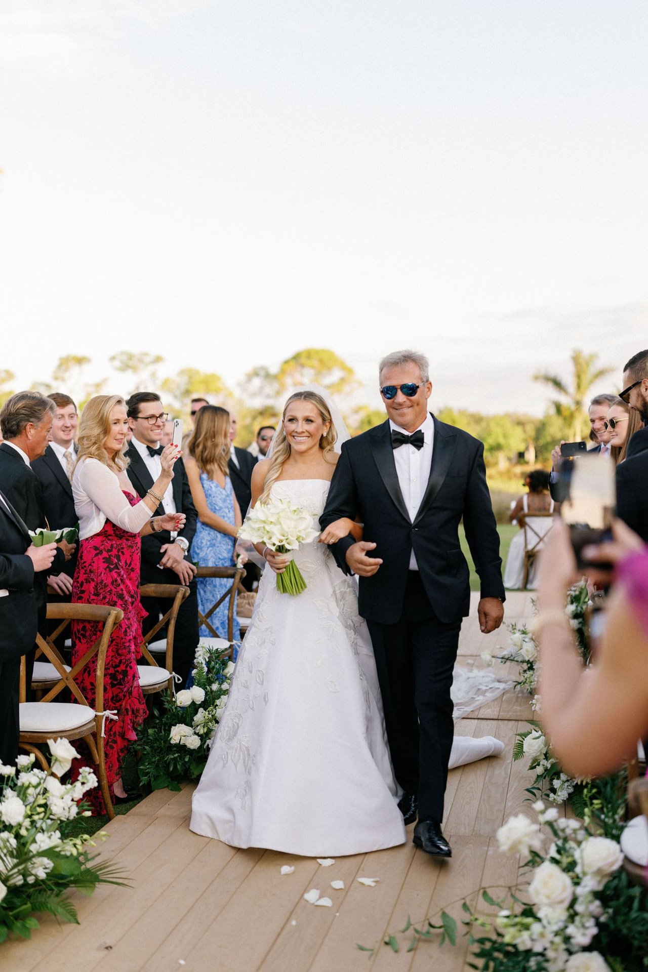 Bride Walking Down Wood-Plank Ceremony Aisle