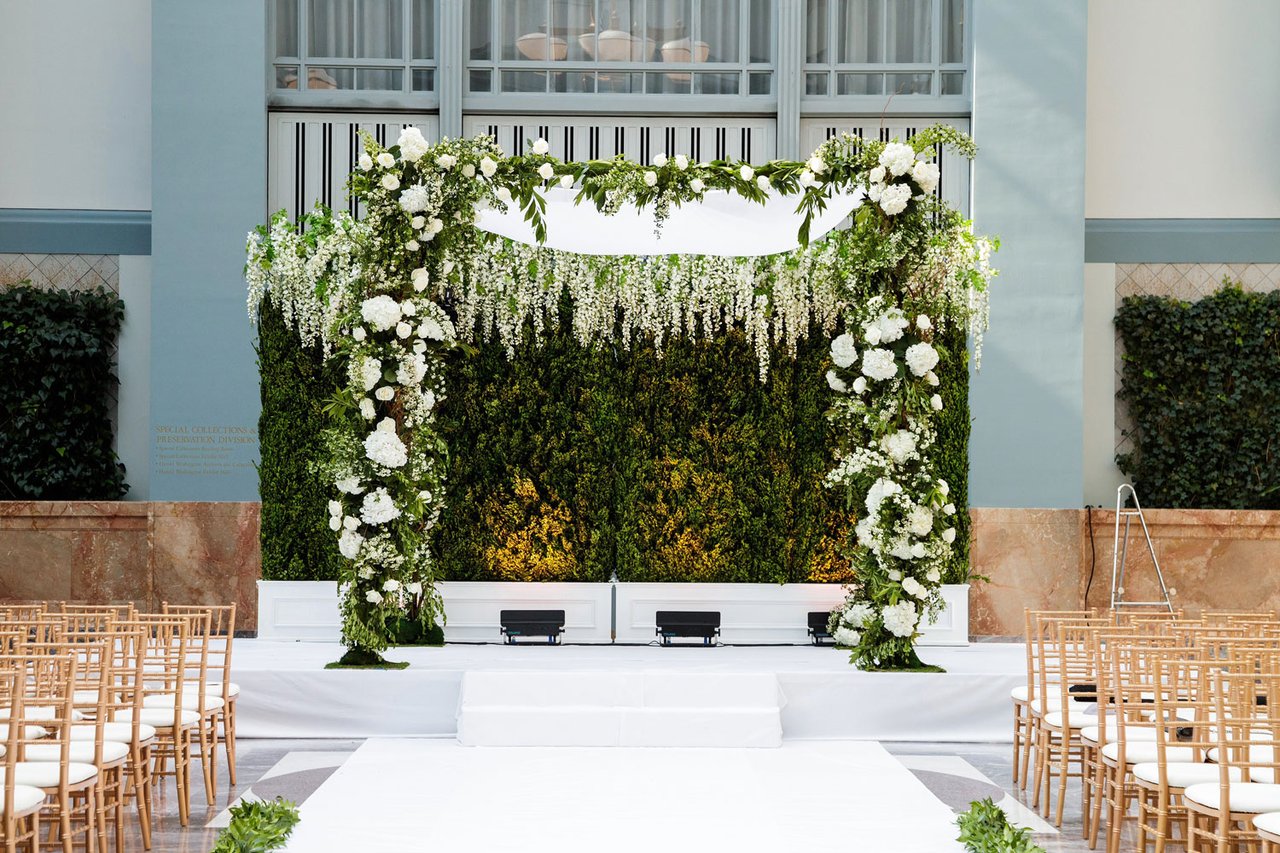 Chuppah In Front of Hedge Wall