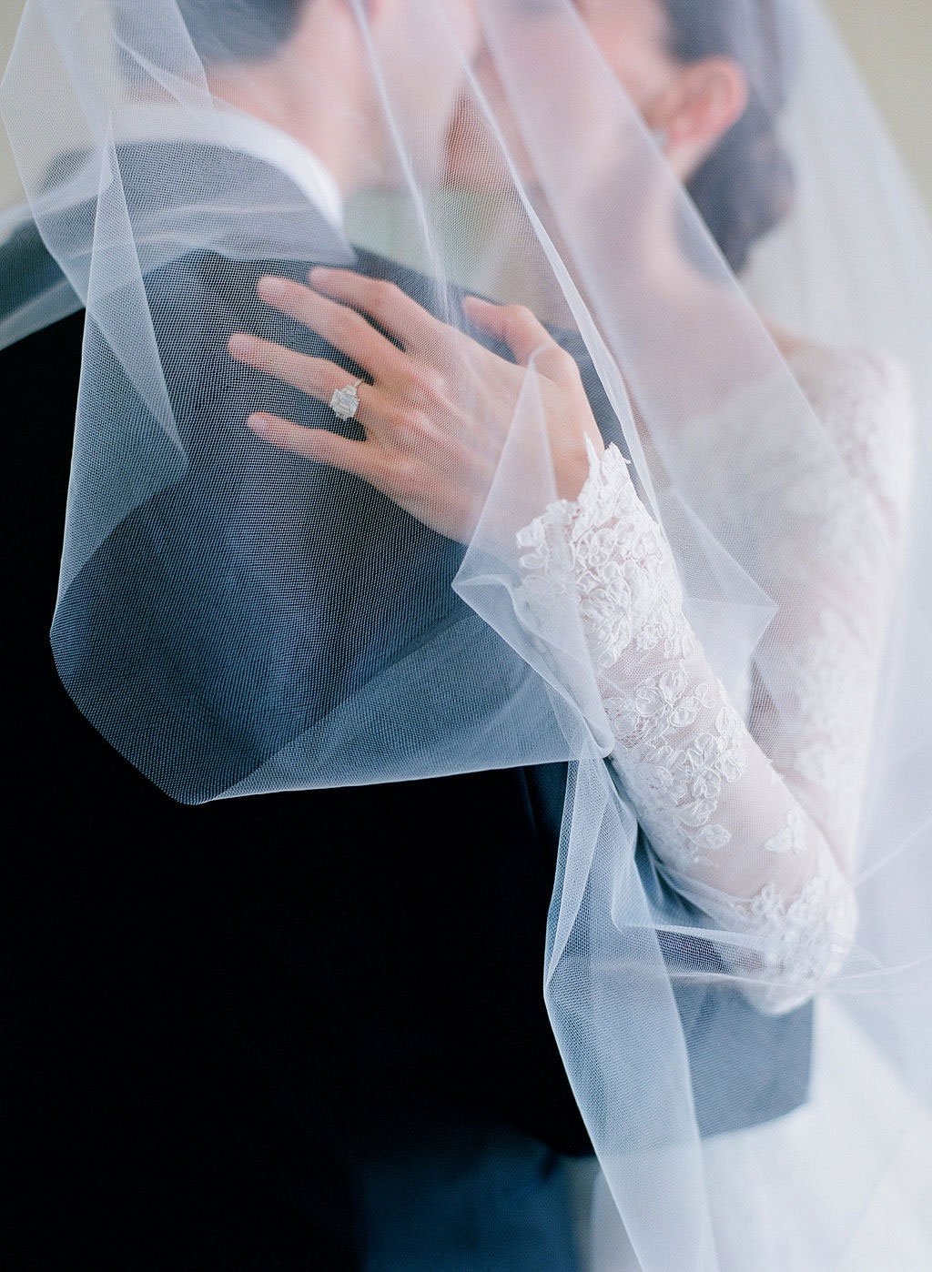 Romantic Veil Photo of Bride & Groom Kiss