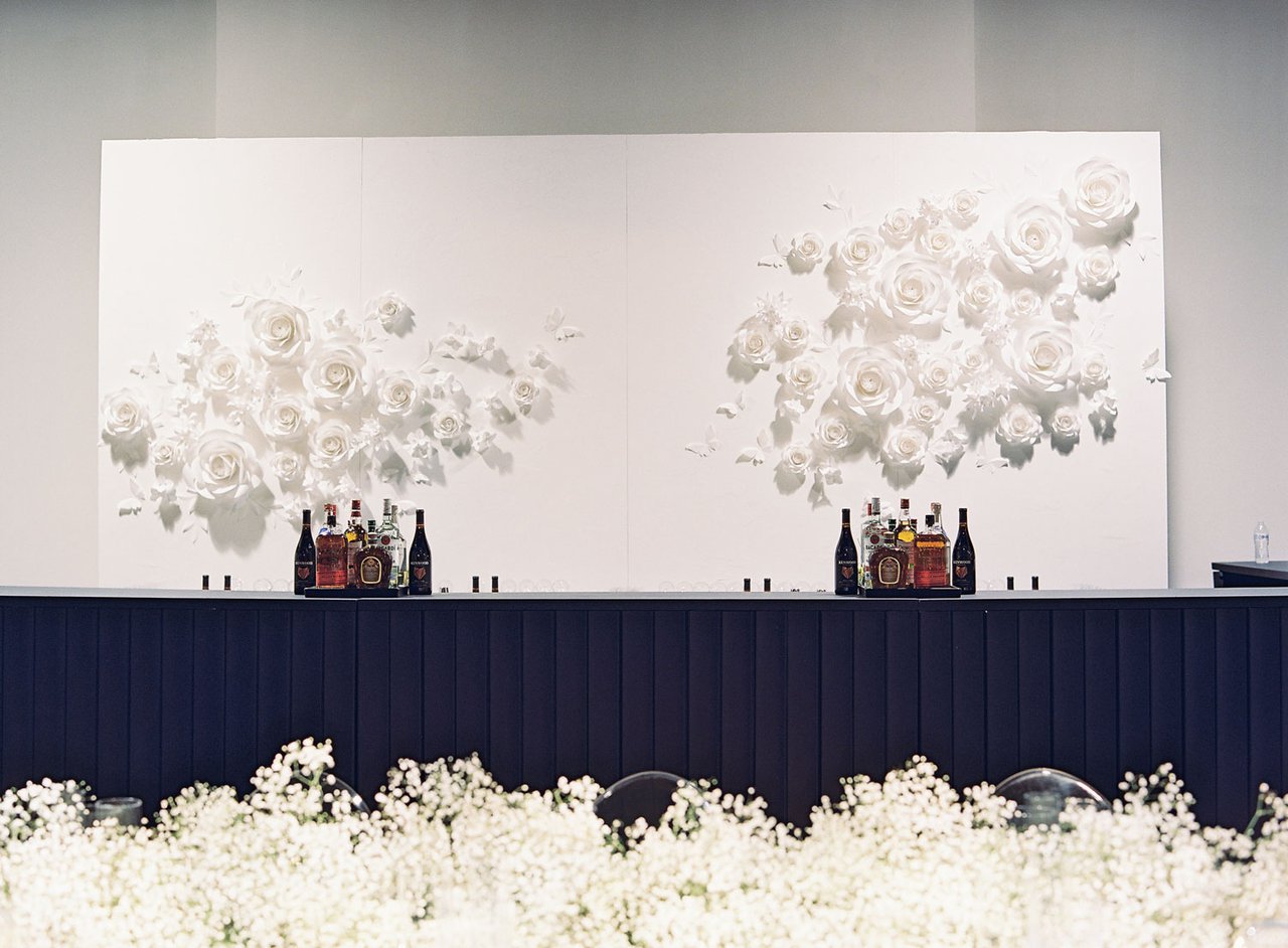 Modern White Roses Behind Wedding Bar