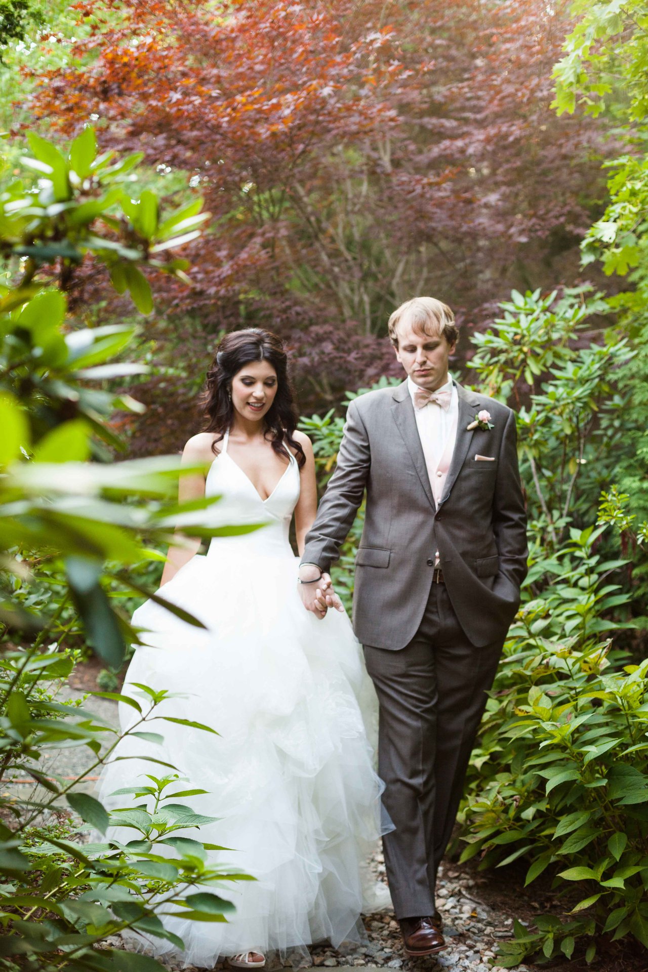 Bride and Groom Walk Through Garden