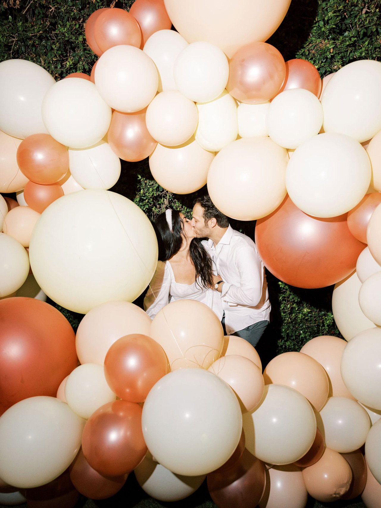 Bride & Groom Kiss Inside Balloons