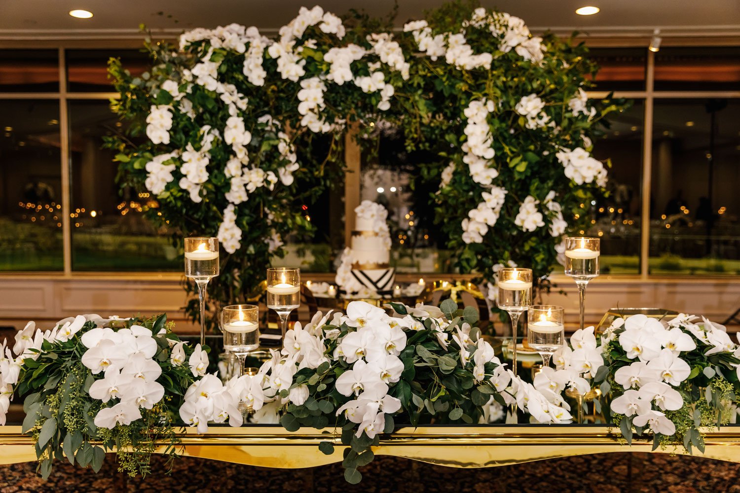 Sweetheart Table In Front of Cake Display