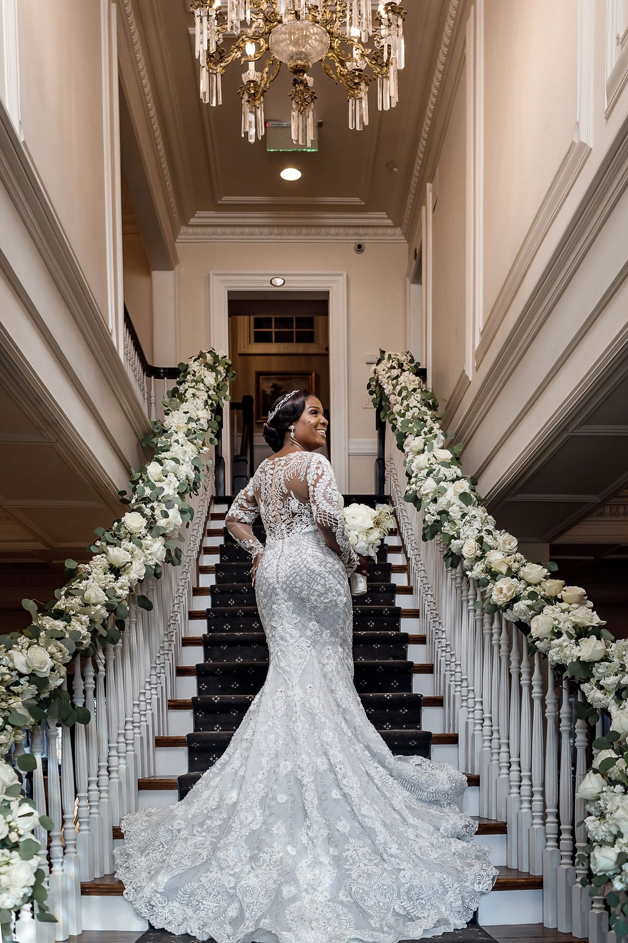 Bride in Long-Sleeve Gown on Staircase