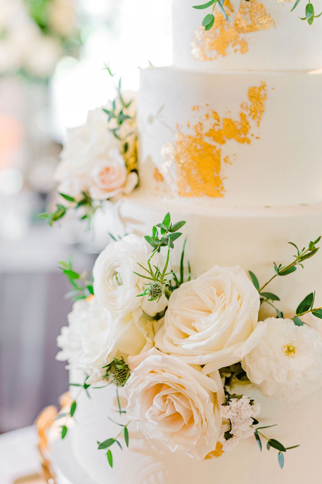 Close Up of Fresh Flowers & Gold Foil Cake