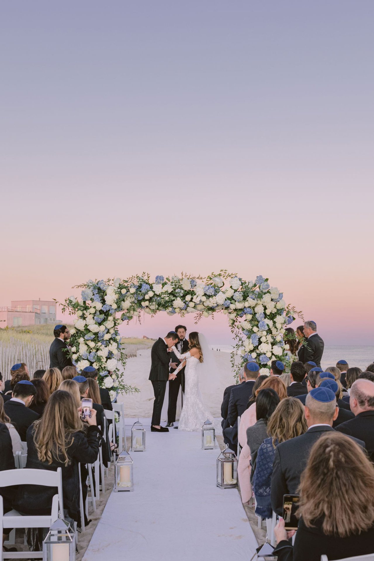 Vow Exchange During Sunset Beach Ceremony