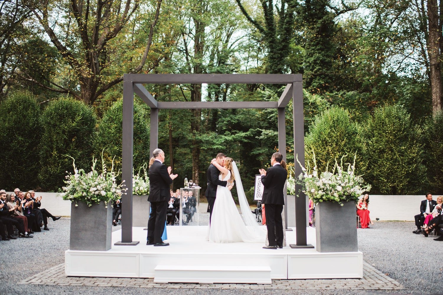 Kiss Beneath Modern Chuppah