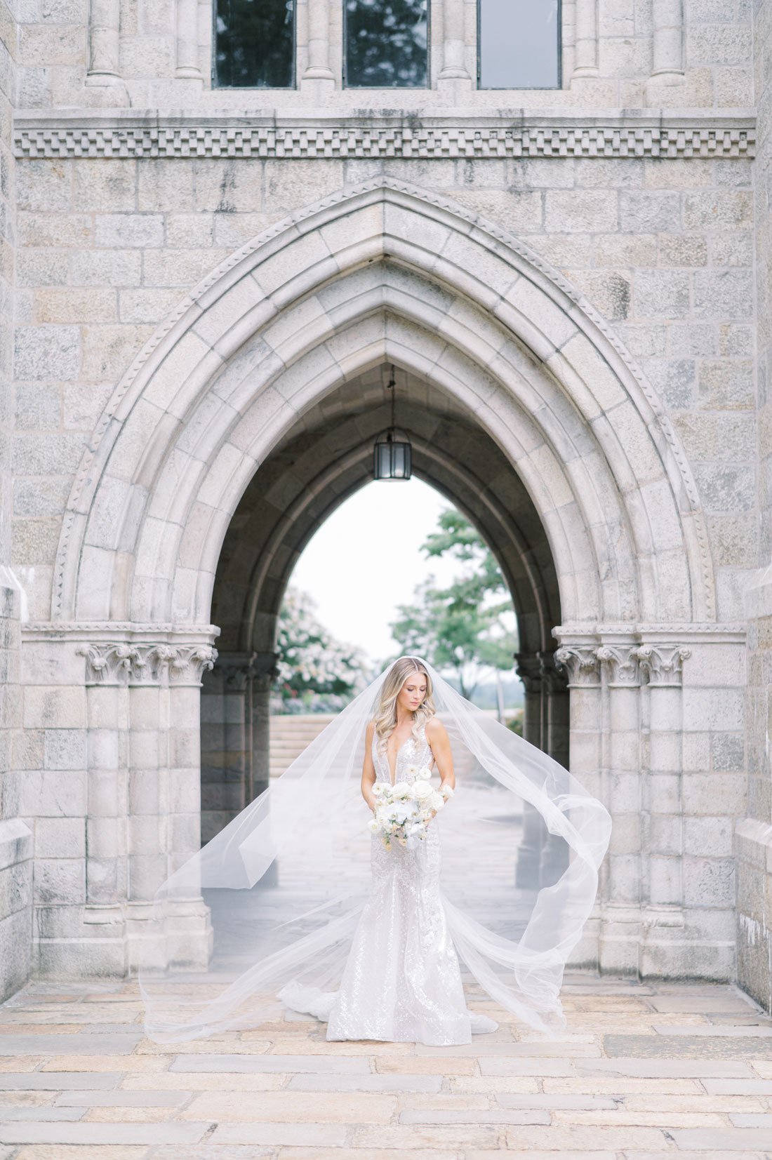 Bridal Portrait with Veil Blowing in Wind