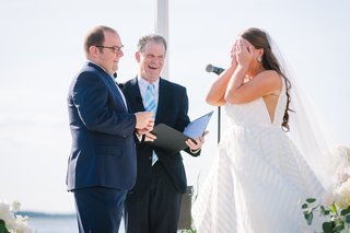 Bride Covers Face During Ceremony