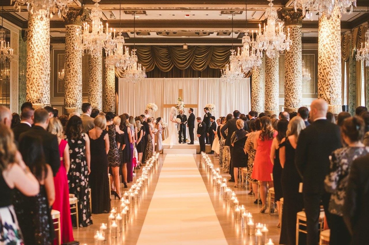 Guests Standing at Hotel Ceremony