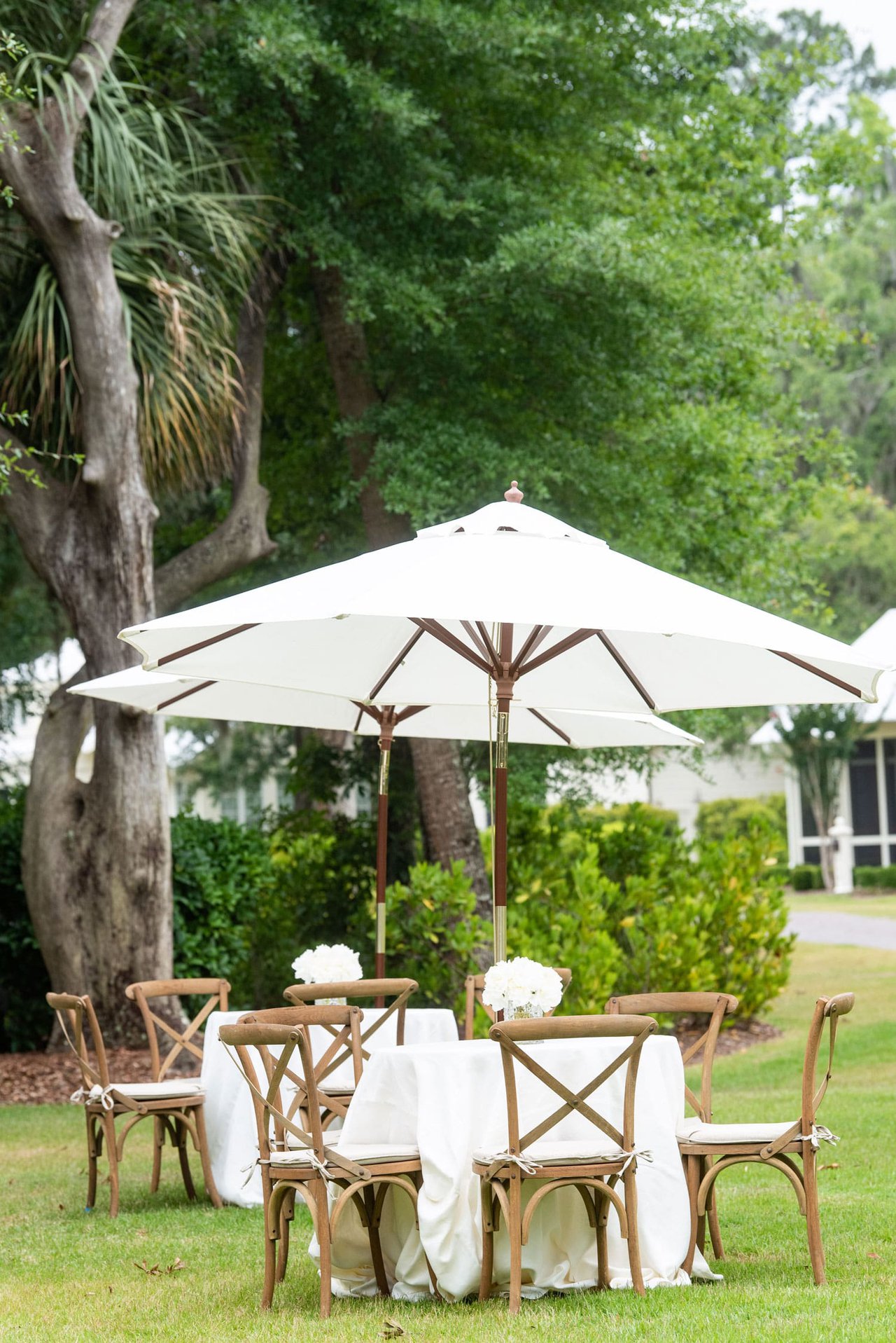 Outdoor Cocktail Hour Tables with Umbrellas