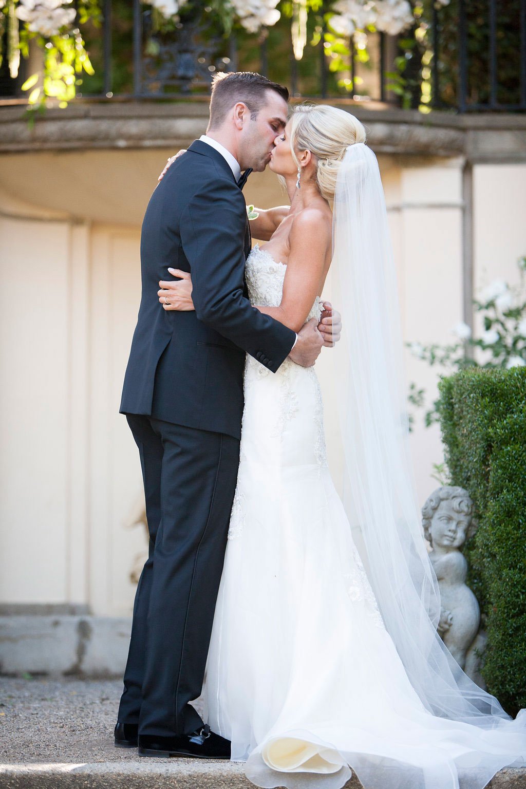 Bride and Groom Share First Kiss at Estate