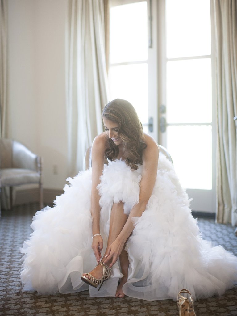 Bride Putting on Strappy Heels