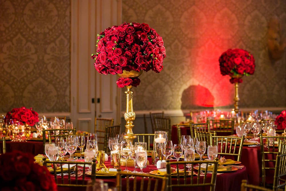Arrangement of Red Roses on Gold Stands