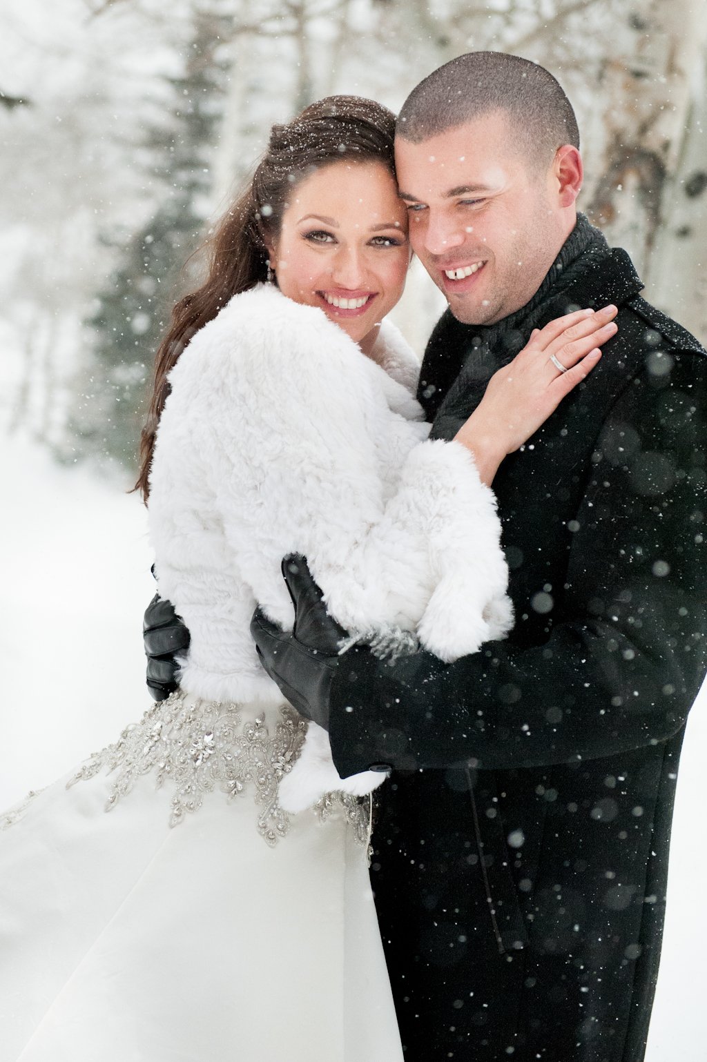 Couples Photos - Bride and Groom Wearing Winter Coats - Inside Weddings