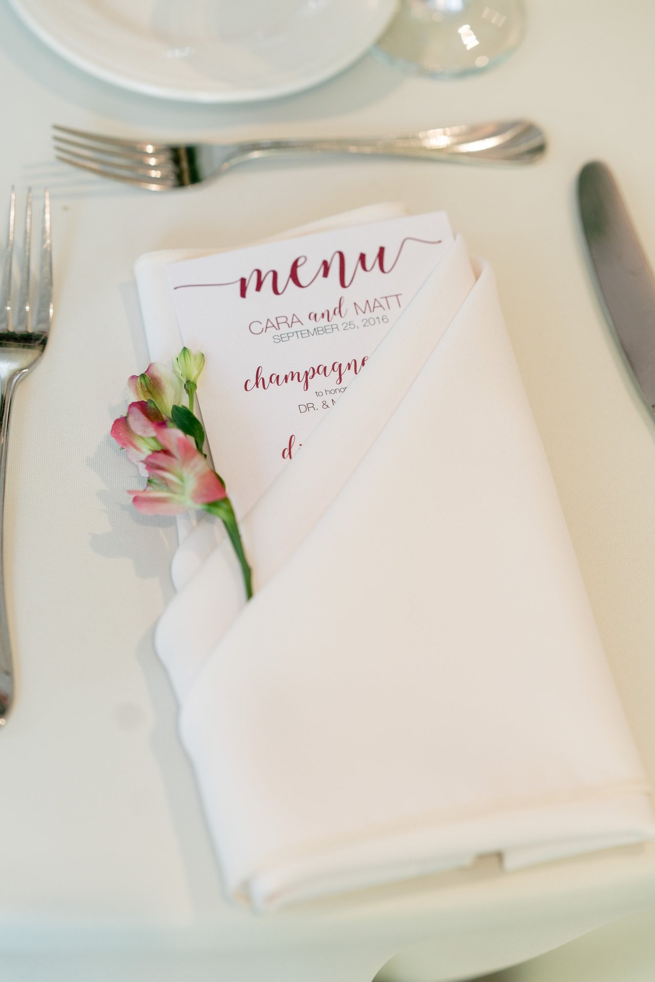Bloom Tucked into Napkin with Menu