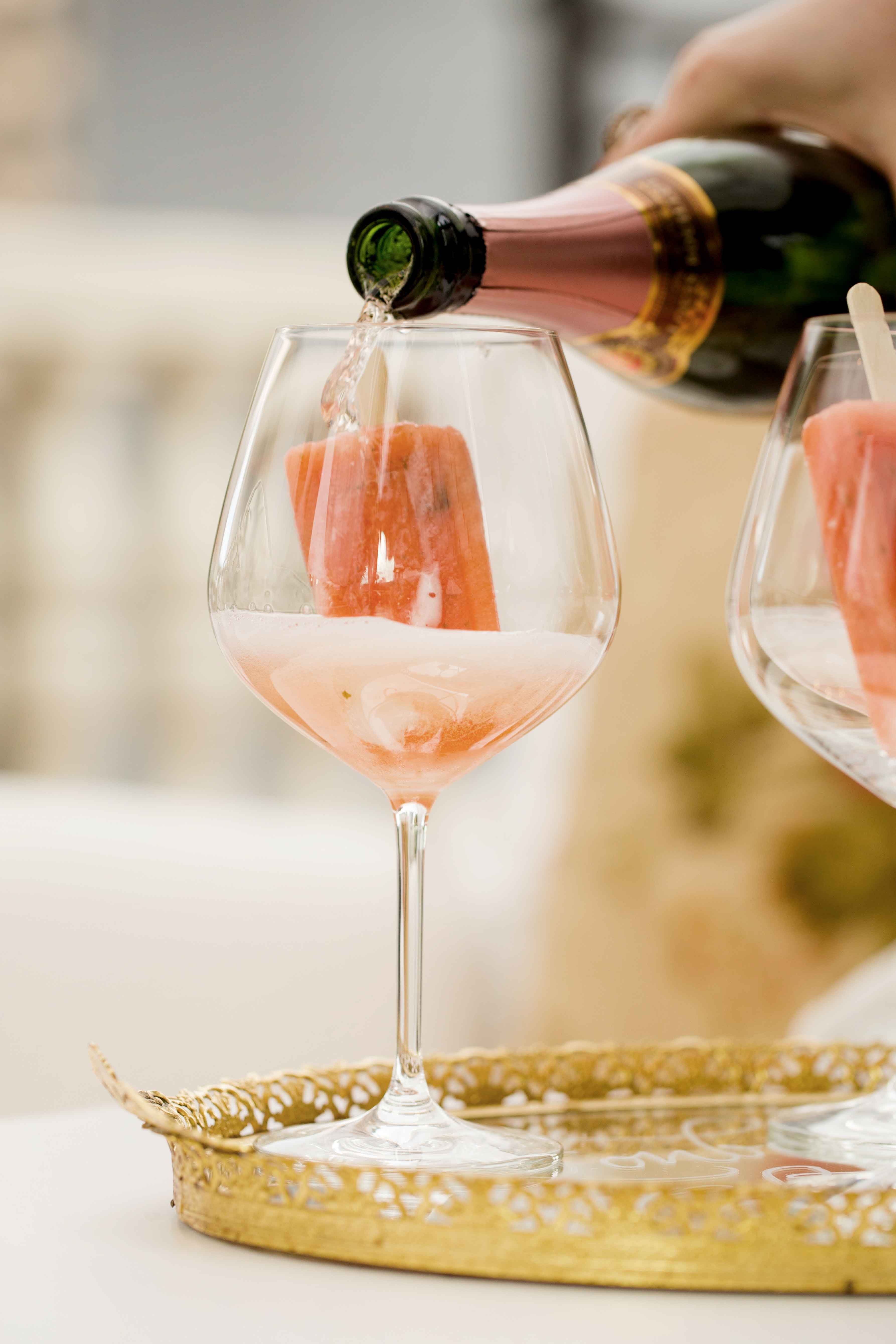 Pink Champagne Poured Over Gourmet Popsicles