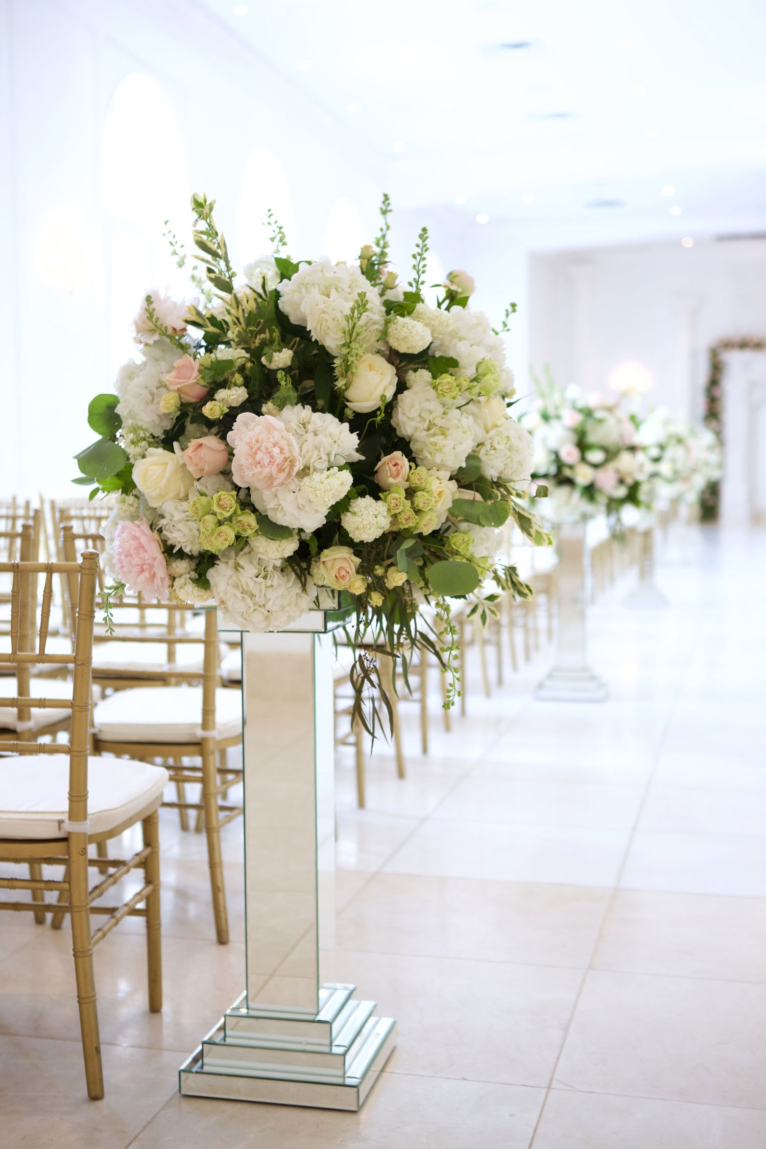 Mirrored Riser with Lush Blooms