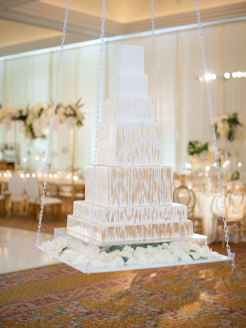 Tall Wedding Cake on Swing at Reception