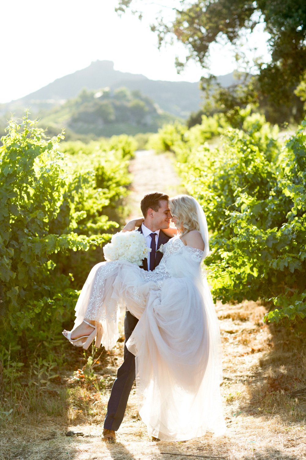 Groom Carrying Bride