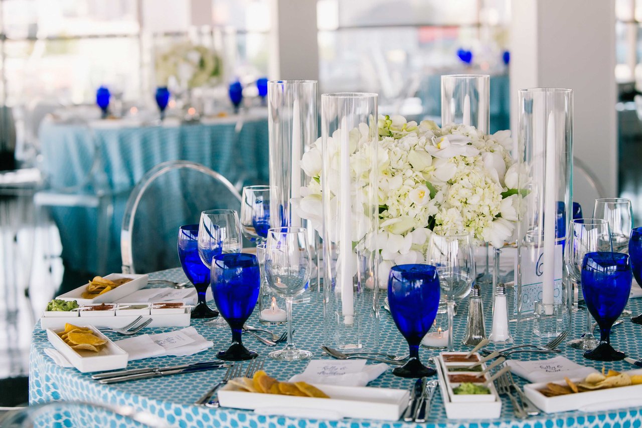 Blue Spotted Table Linens and White Centerpieces