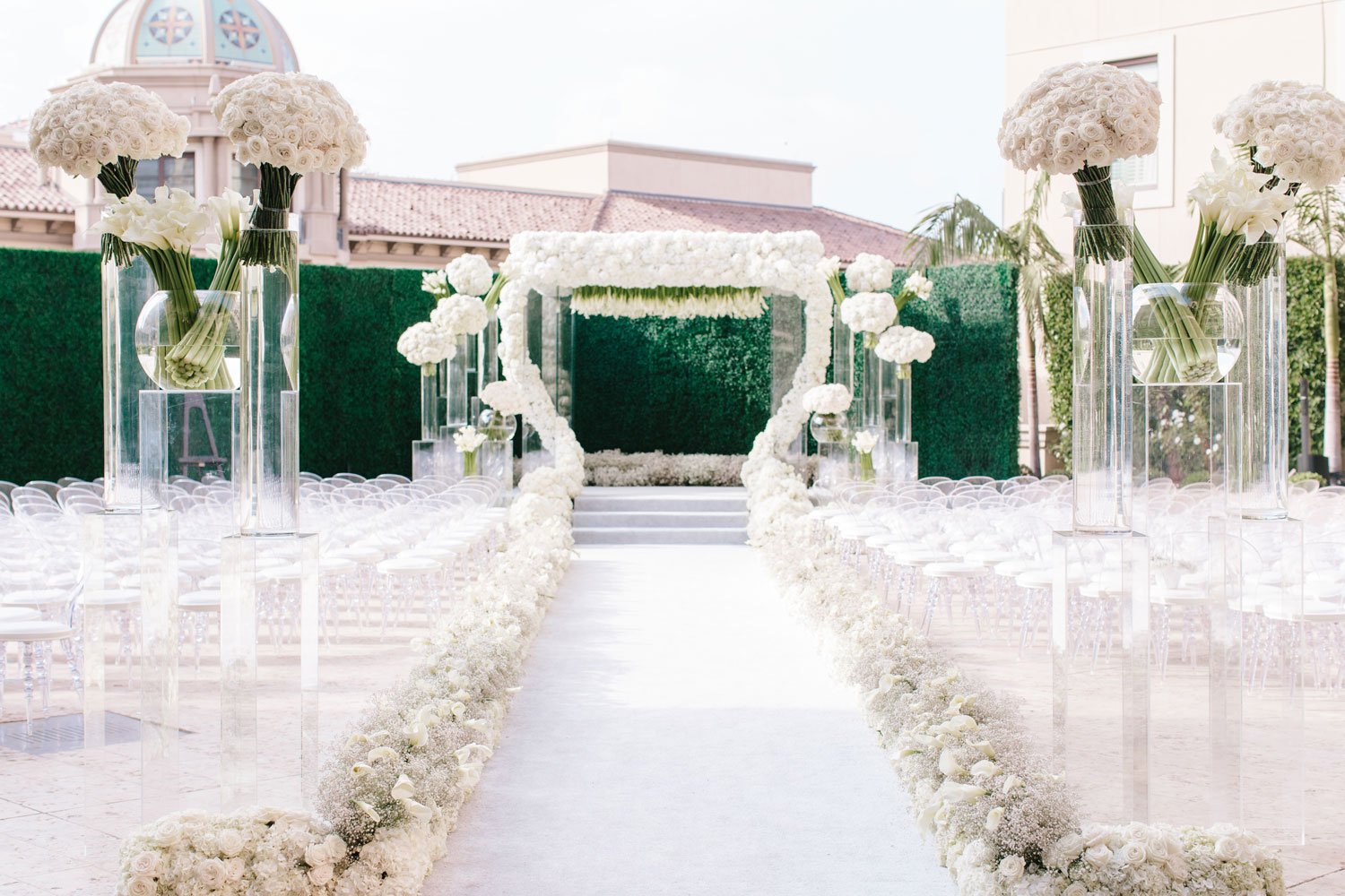 All-White Ceremony with Hedge Wall