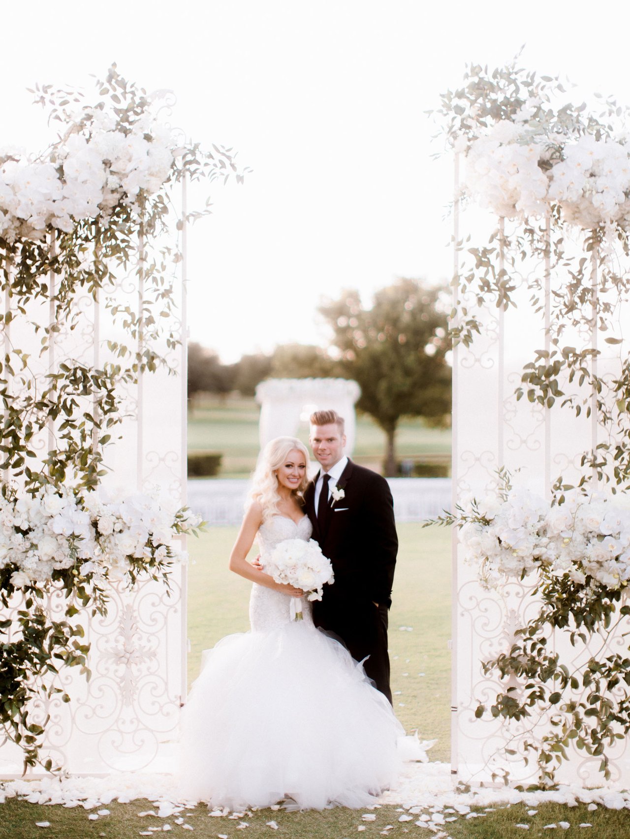 Bride & Groom Next to Tall Gates