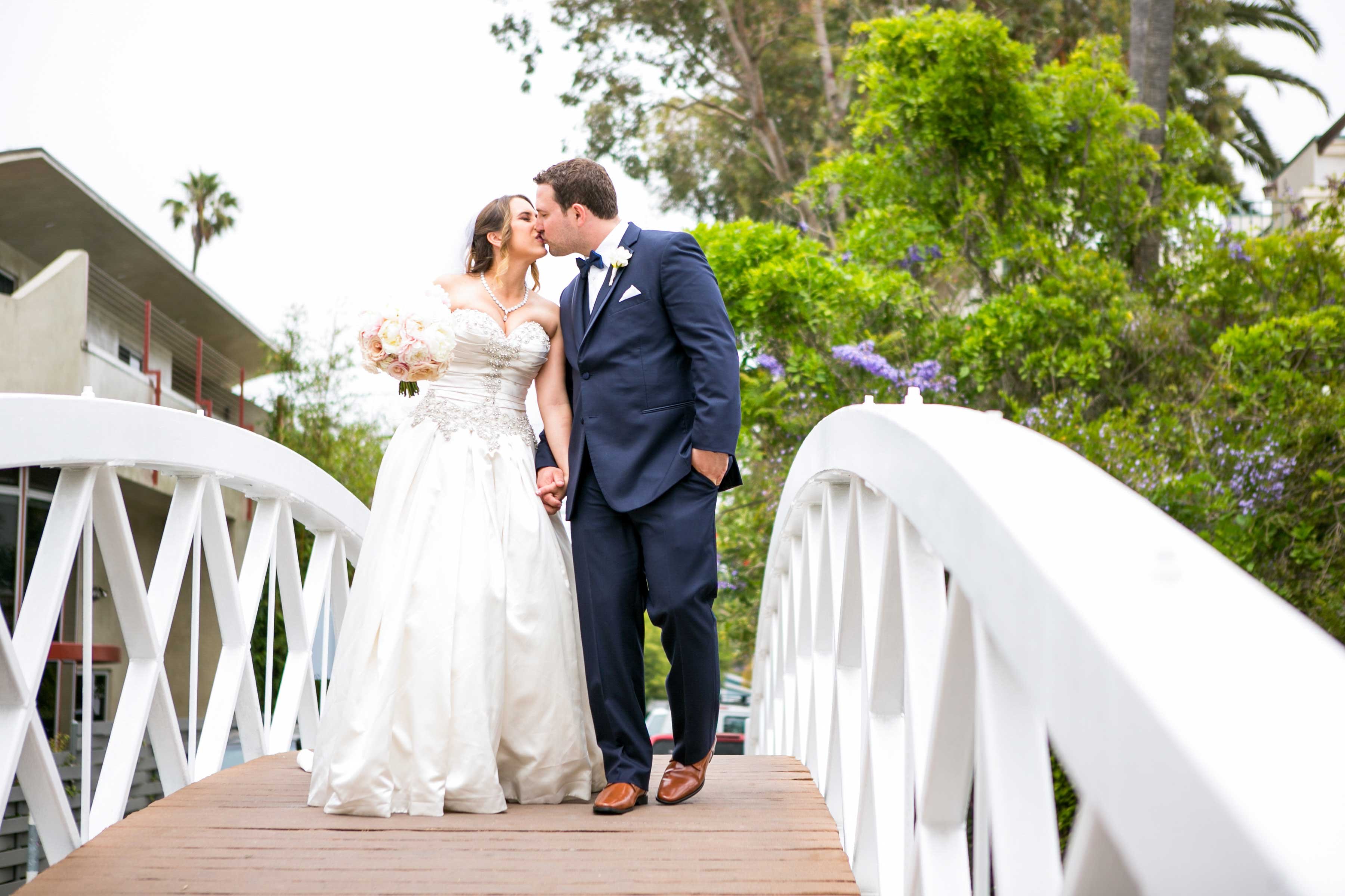 Bride and Groom Kiss on Bridge