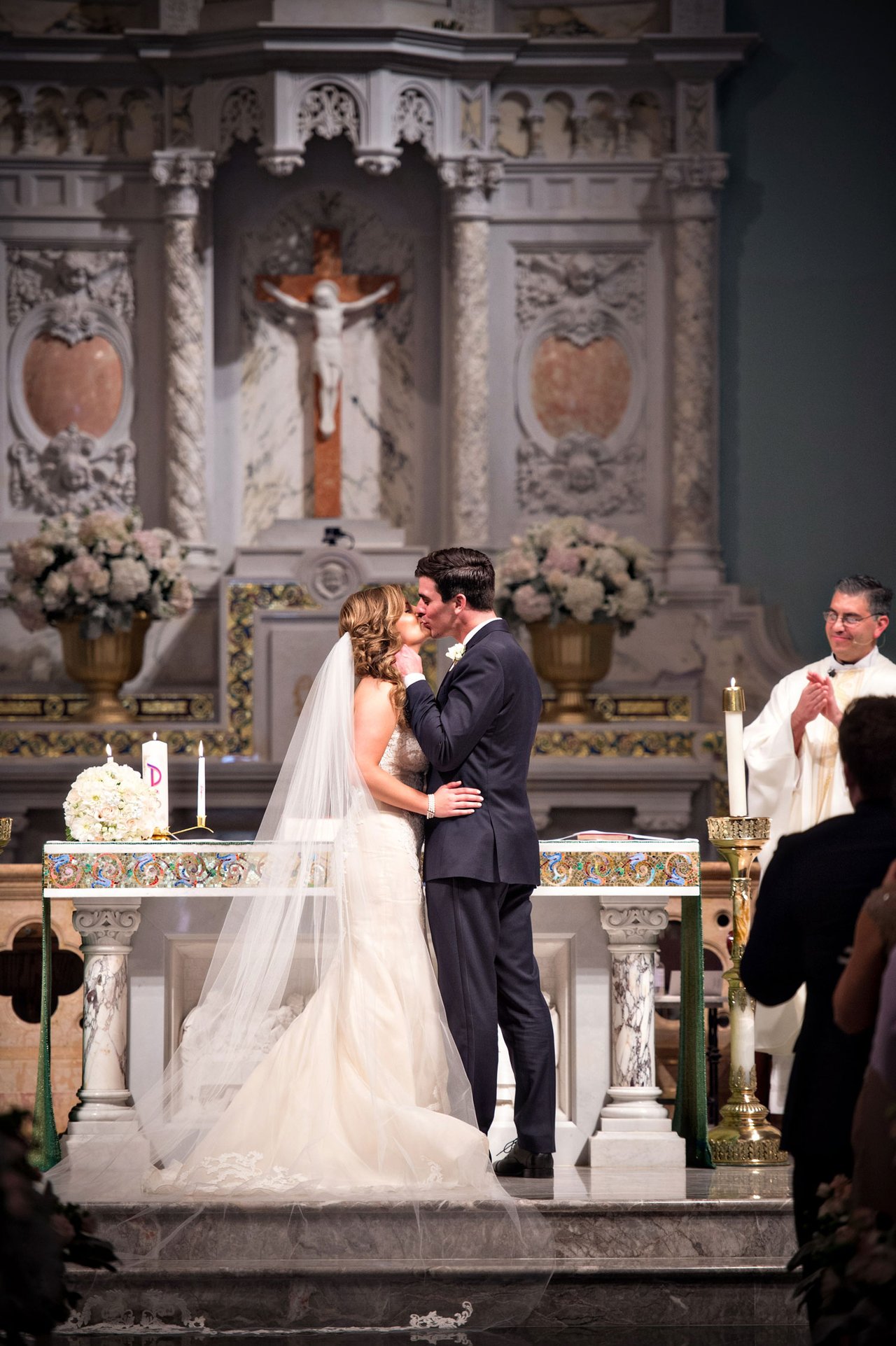 Couple Kisses at Traditional Ceremony