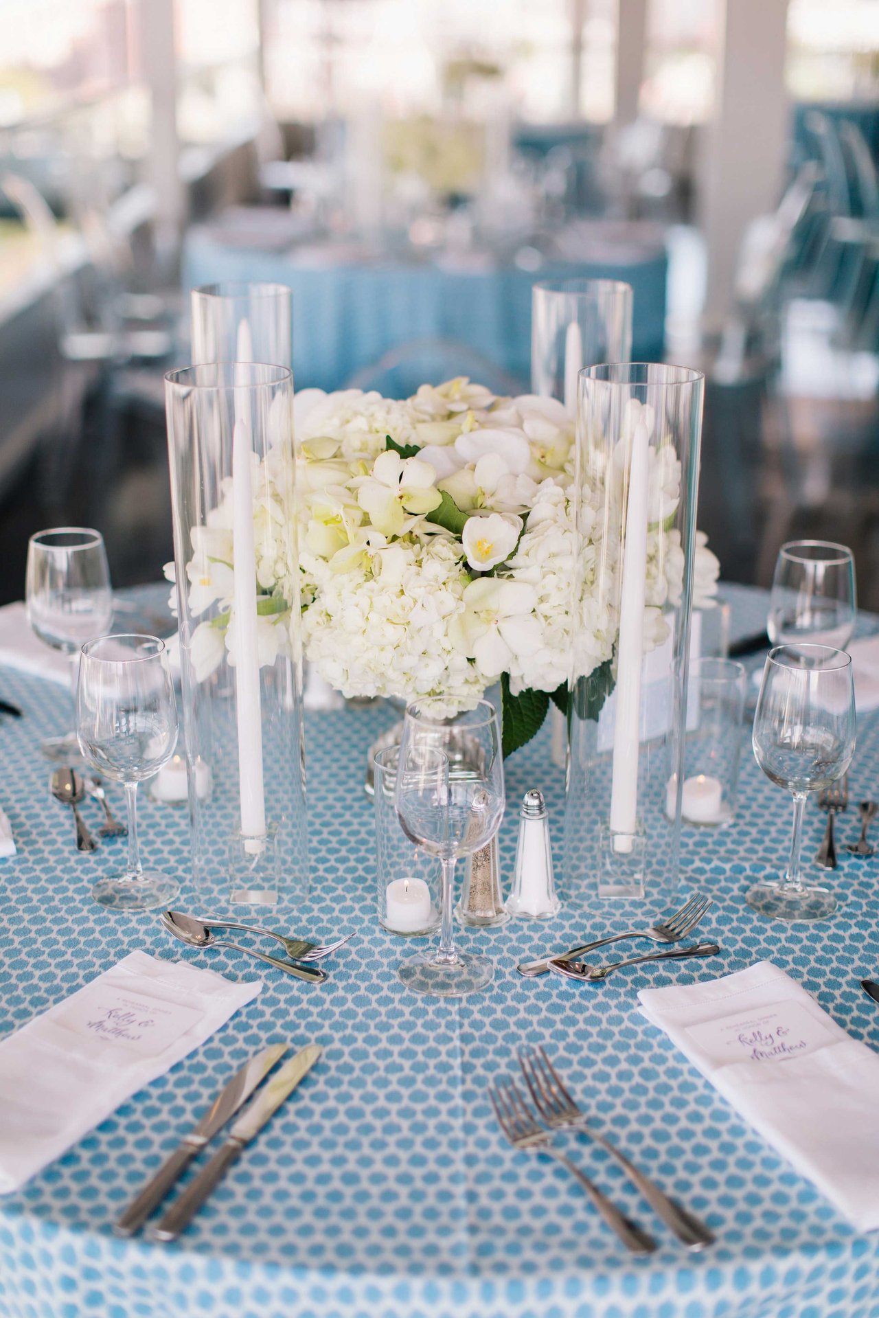 Blue Spotted Table Linens with White Flower Centerpiece