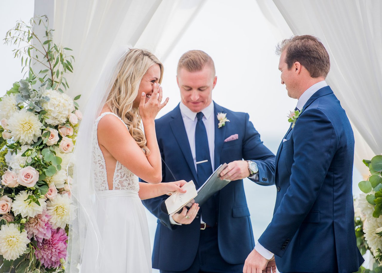 Bride Dabbing Tears at Ceremony
