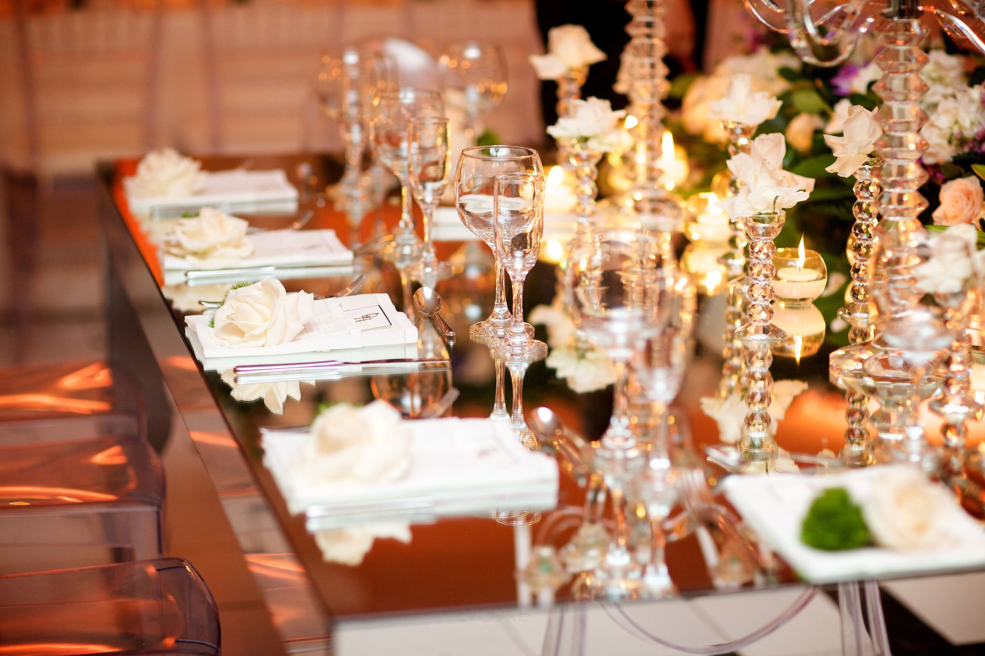 Reflective Table and White Folded Napkins