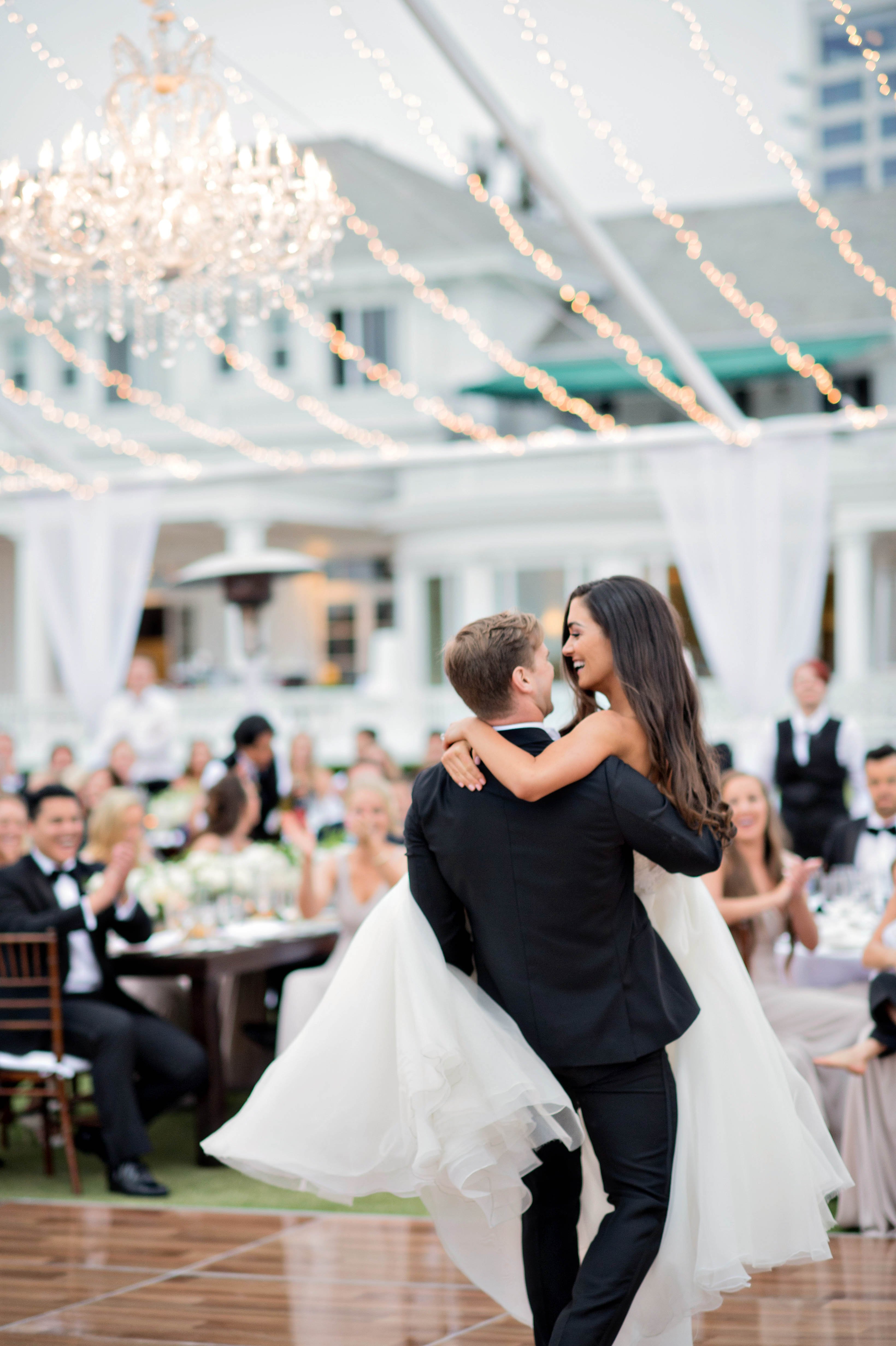 Groom Lifts Bride During Dance